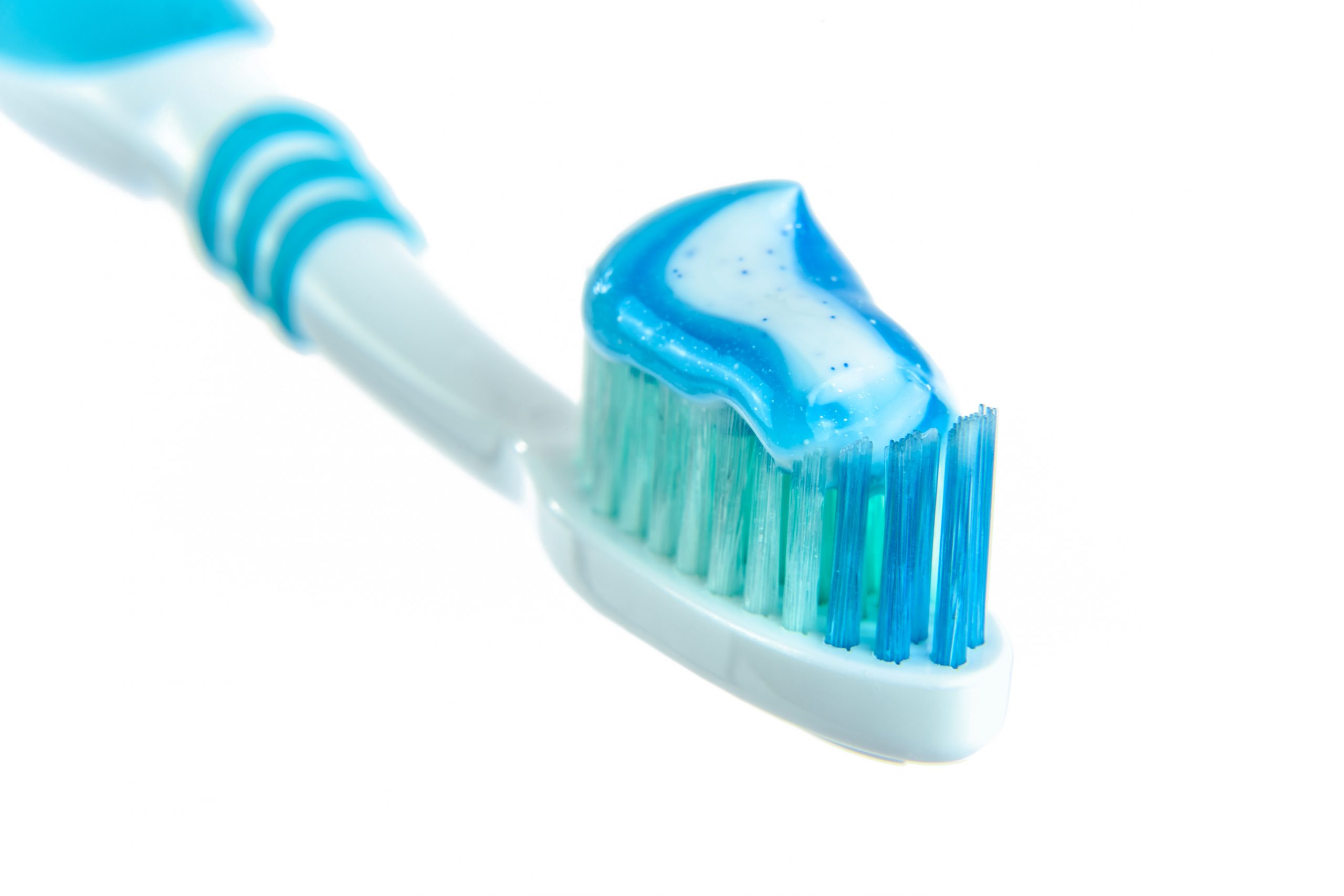 blue-and-white-toothpaste-on-toothbrush-216729 - Galleria Dentistry Blog